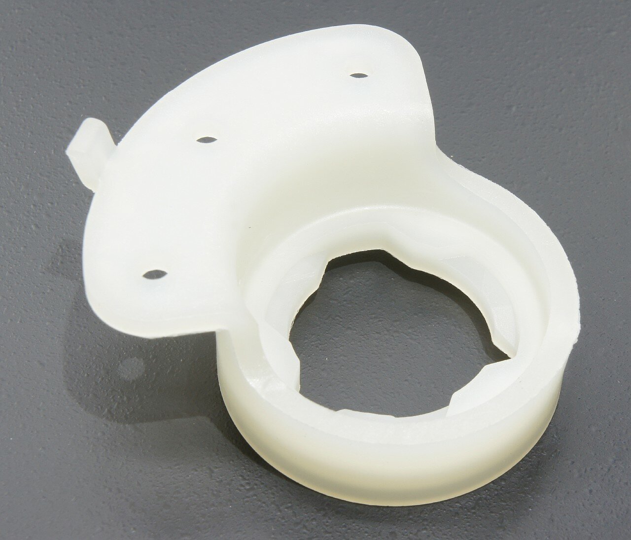 Скоба мотора корректора фар Hella 8HG138620007