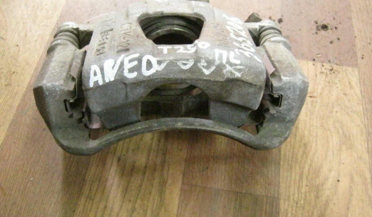 Суппорт передний Aveo (T250) Chevrolet 96534637