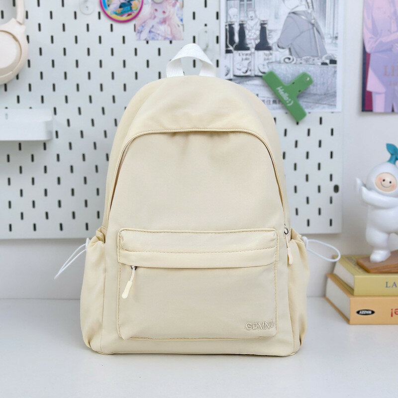 Simple candy colored student lightweight backpack for school and travel brand unknown, white