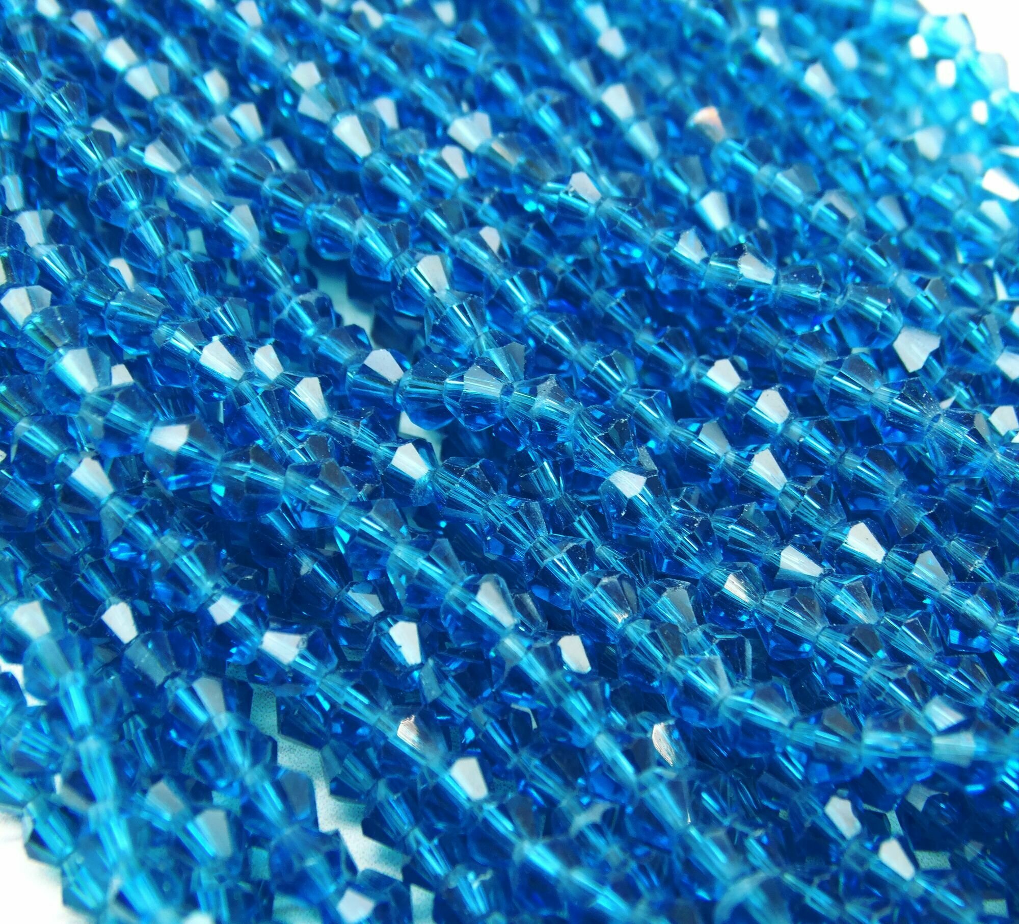 ББ025НН3 Хрустальные бусины "биконус", морская волна прозрачный, размер 3 мм, кол-во: 295-300 шт.