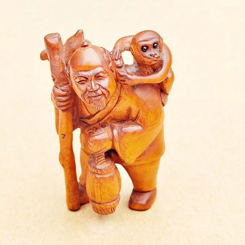 Статуэтка из самшита "Старший человек с обезьянкой"