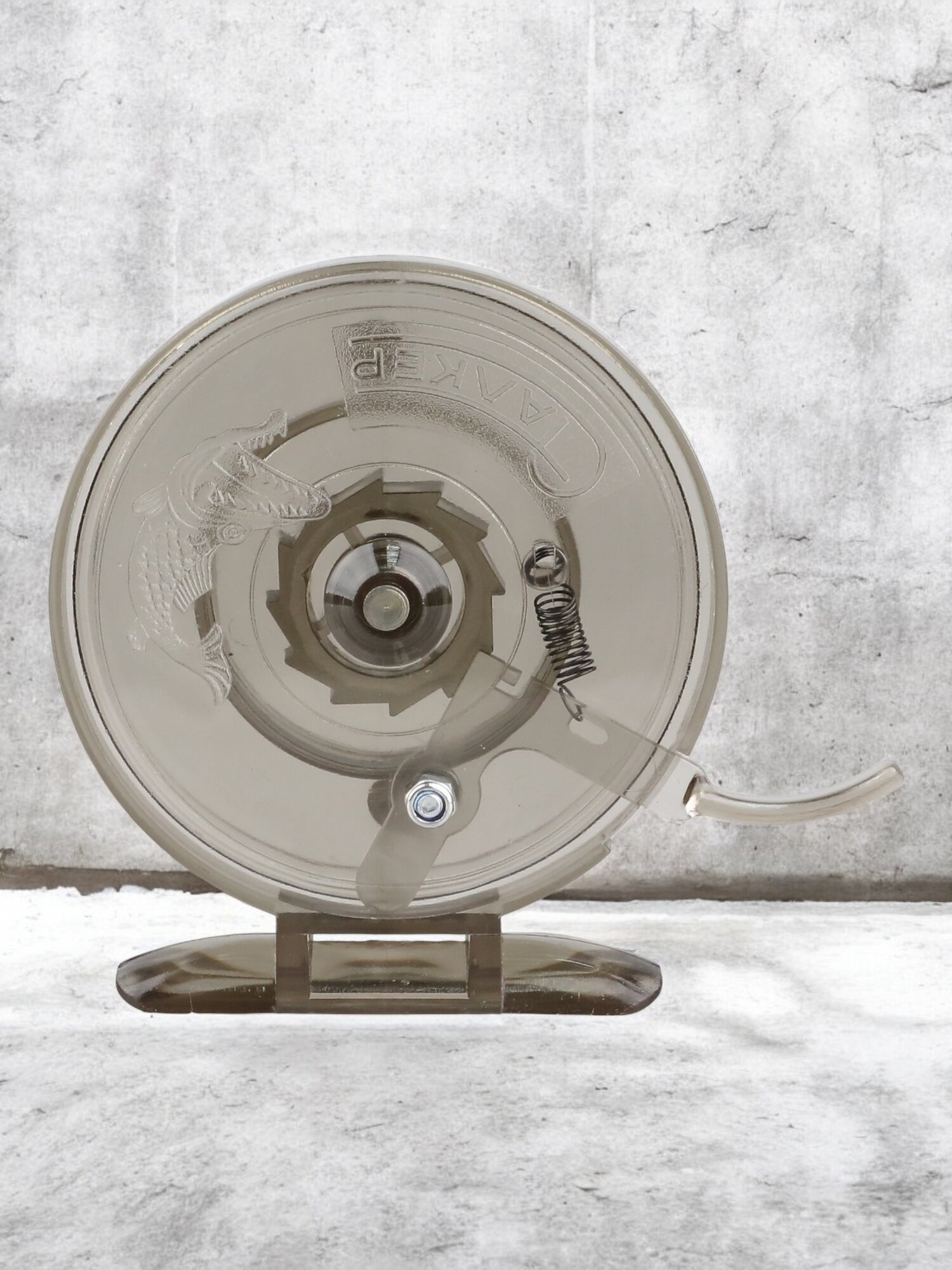 Катушка рыболовная инерционная Сталкер D70 мм с курком прозрачный