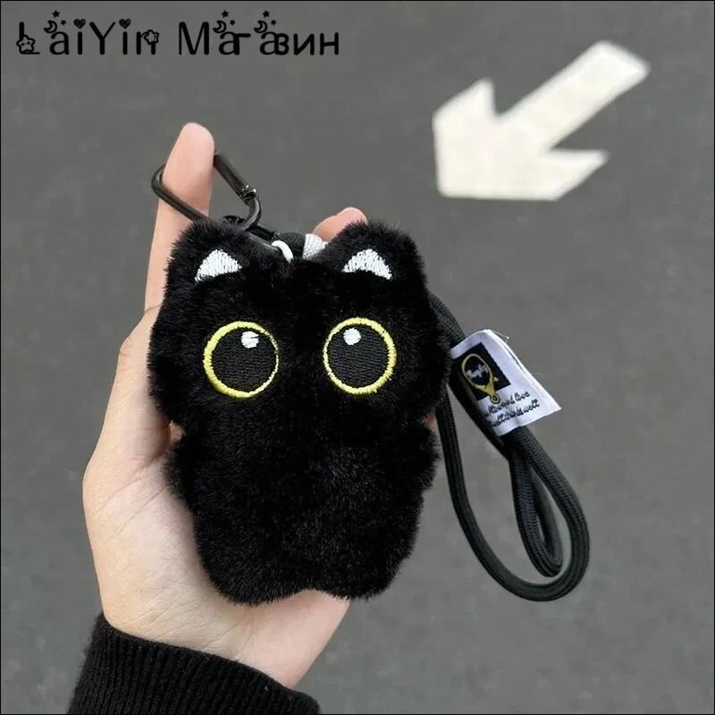 Кукла черной кошки, которая может издавать звуки. Высота 10 см