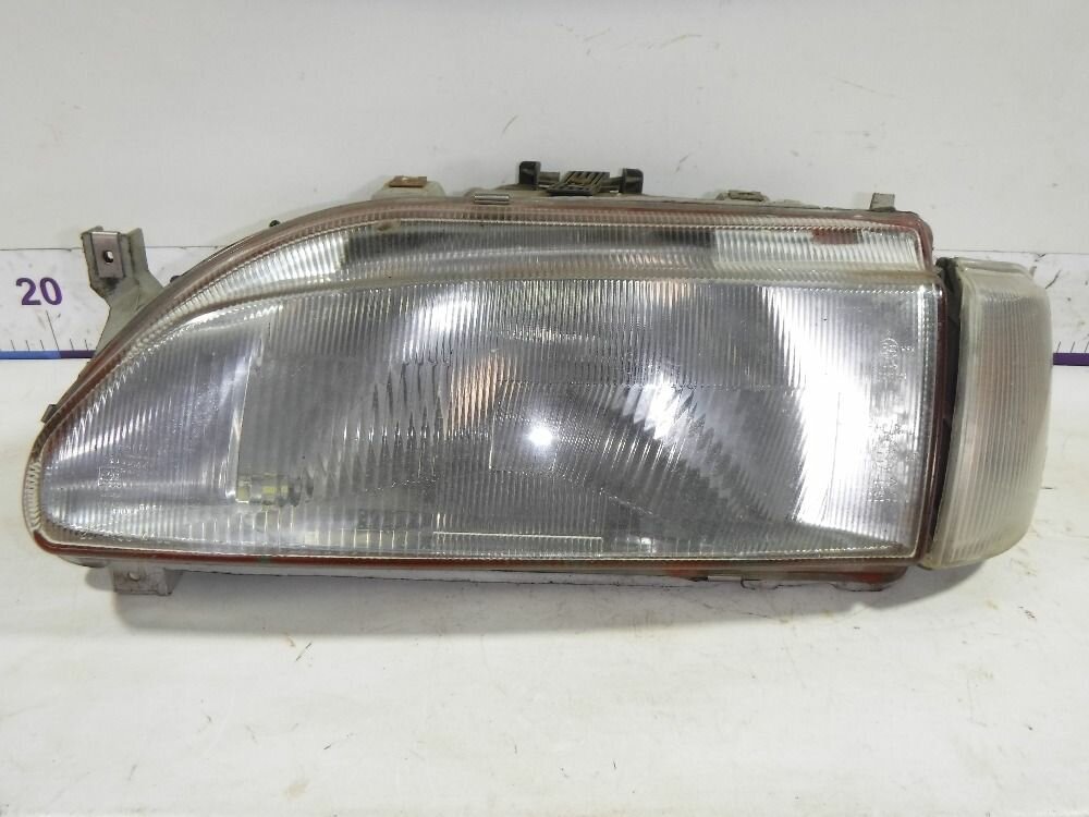 Фара левая Renault R19 7701042945