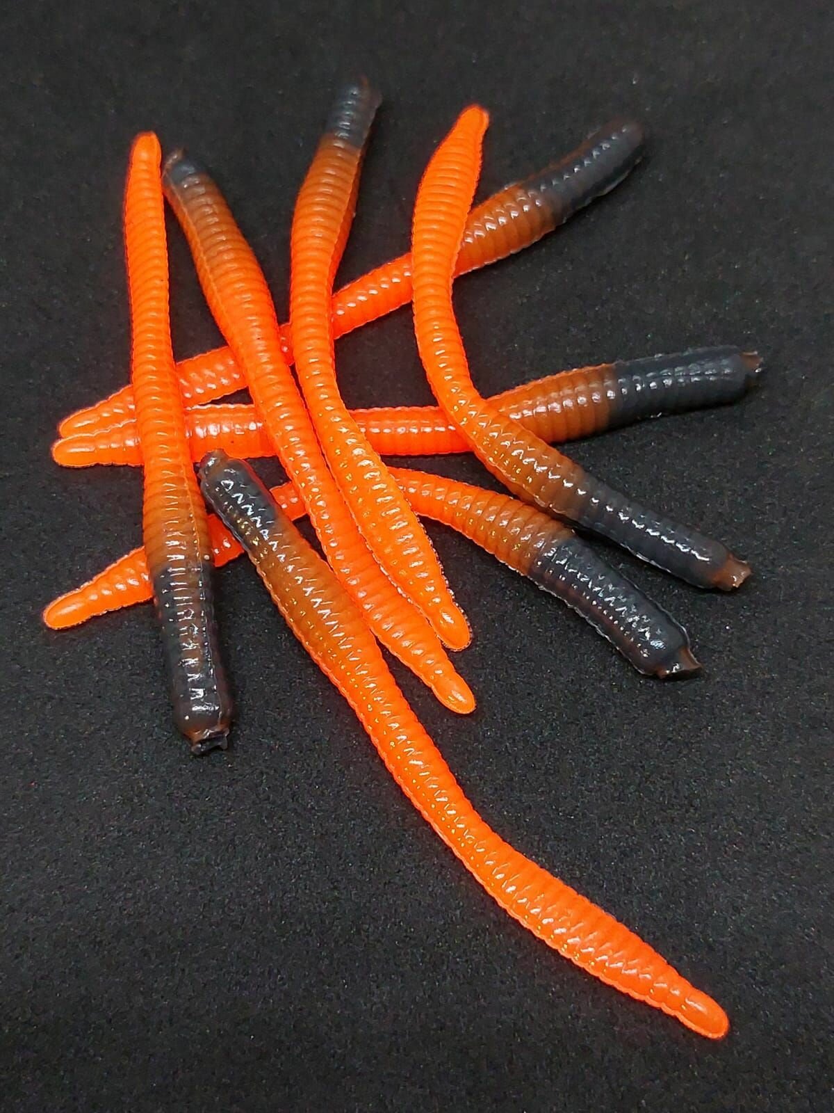 Силиконовые сьедобные приманки "Бобровый хвост". цвет черный- оранжевый.