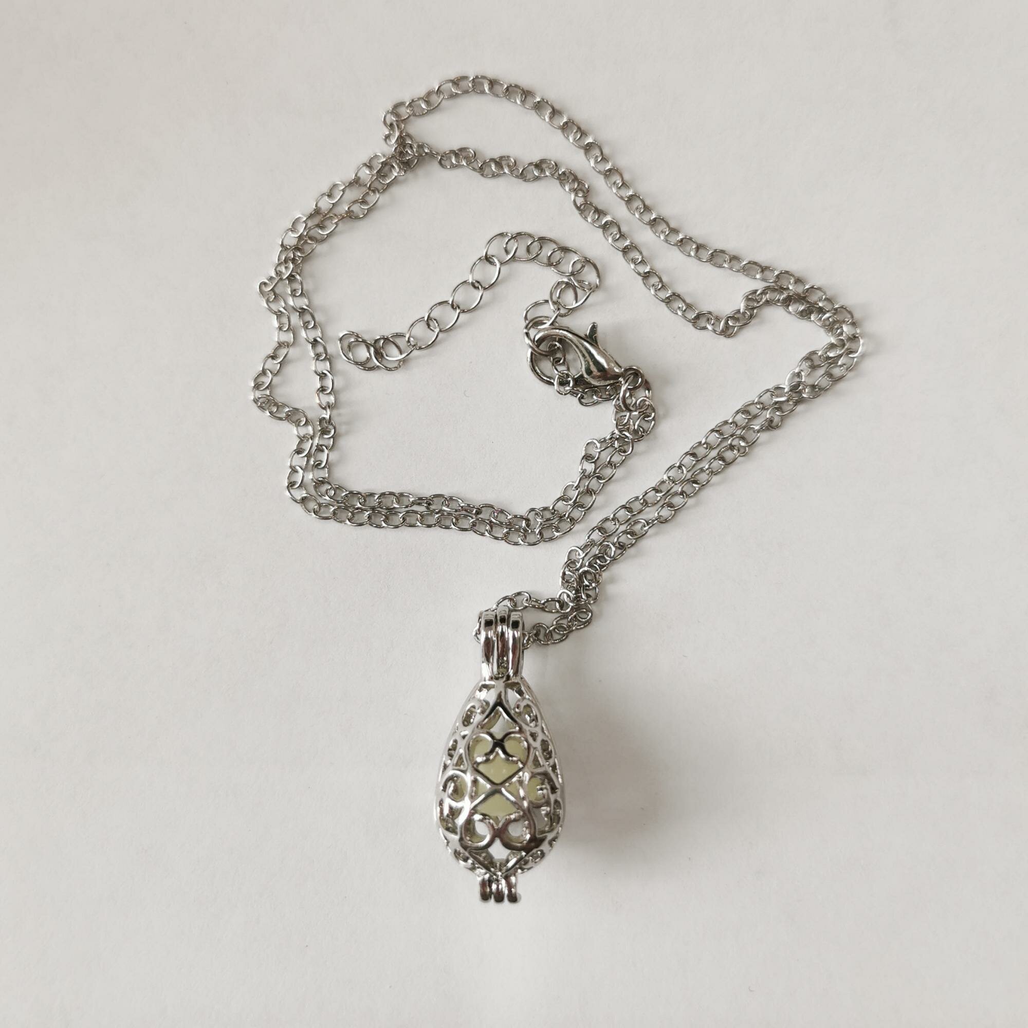 Подвеска 28х12.5х12мм, ажурная капля - клетка, со светящимся голубым шариком, с готовой цепочкой 2.5х2 мм длиной 45 см, базовый материал - цинковый сплав, стального цвета, 1 шт.