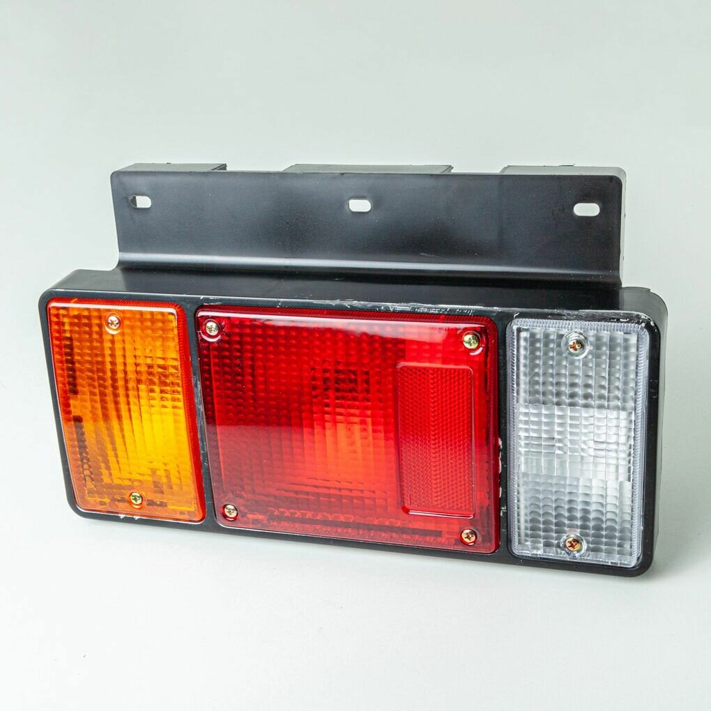 Стоп сигнал ISUZU ELF, левый, с задней крышкой, Nilson Auto Parts (прямоугольная фишка)