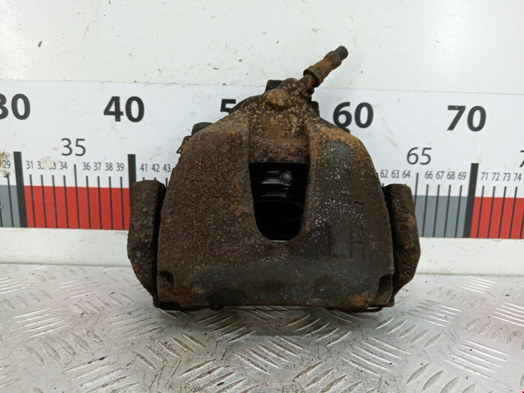 Суппорт передний левый Ford Focus 2 1682876 арт. 1888561