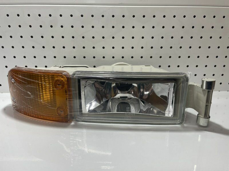 Фара противотуманная левая с желтым поворотником МАН