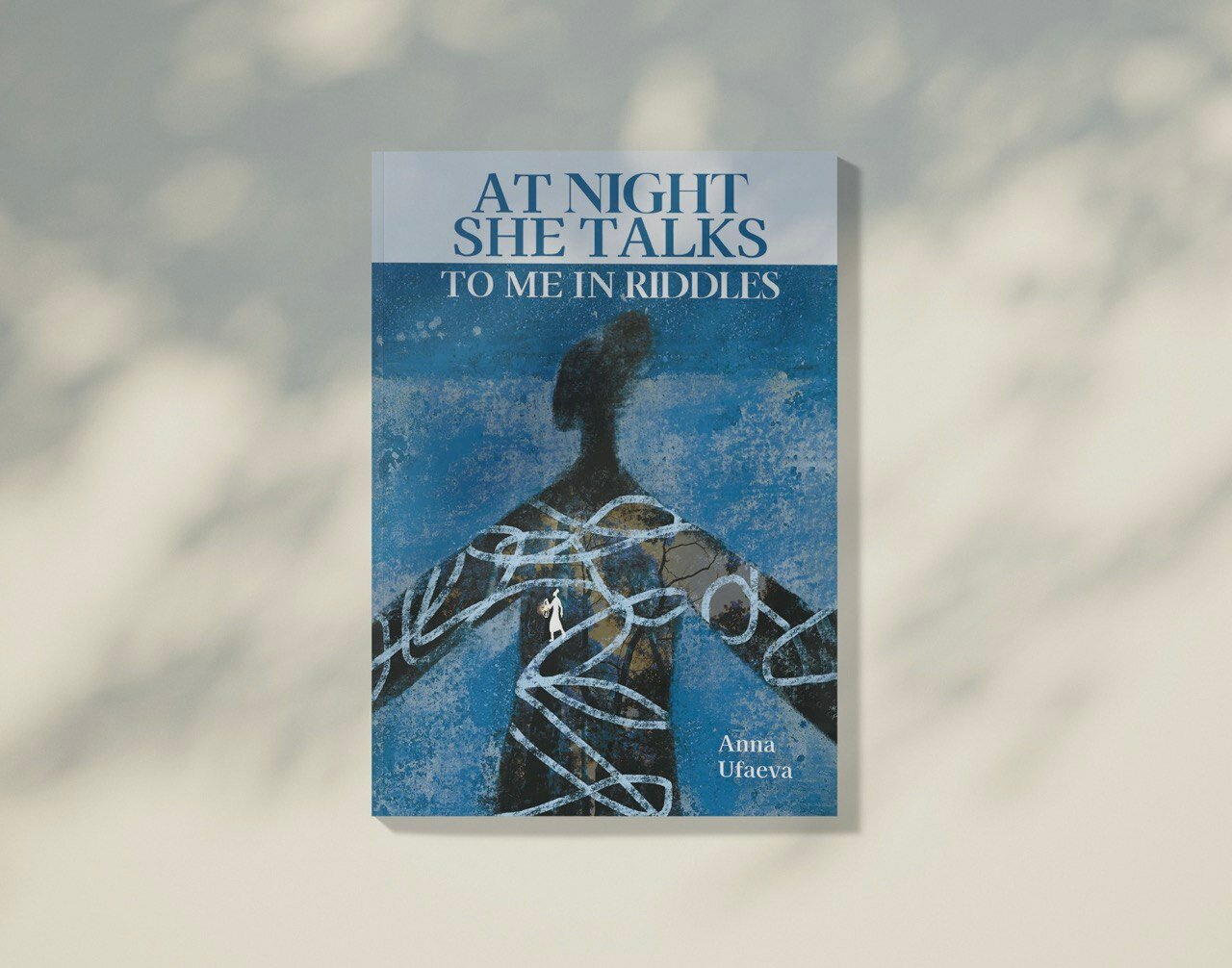Книга "At Night She Talks to Me in Riddles: A Collection of Poetry, Short Stories, and a Play" by Anna Ufaeva