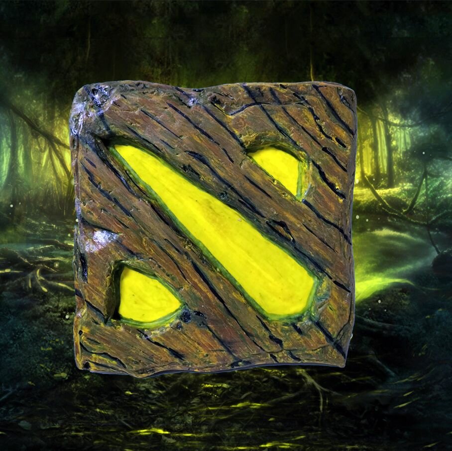 Барельеф логотип Dota 2 со светящимся в темноте эффектом.
