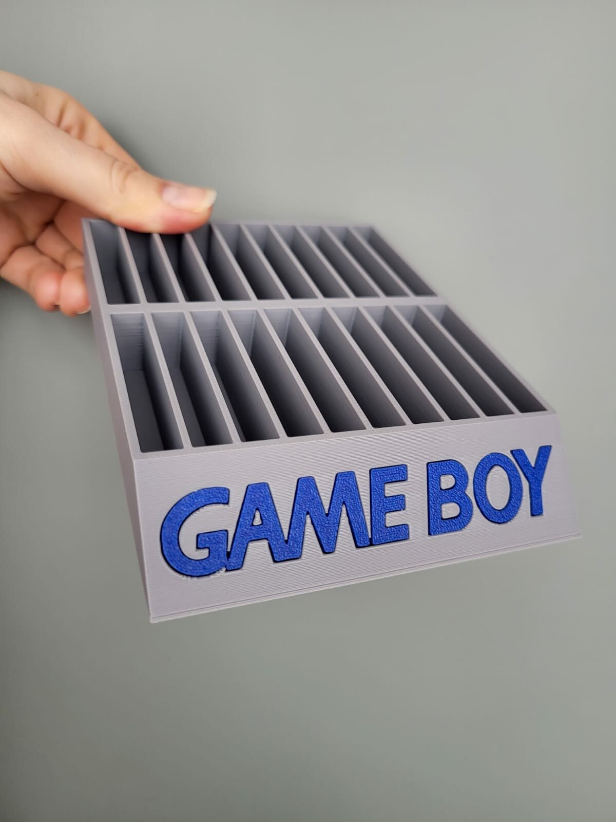 Подставка для картриджей Game Boy без кейсов, серая , из пластика.