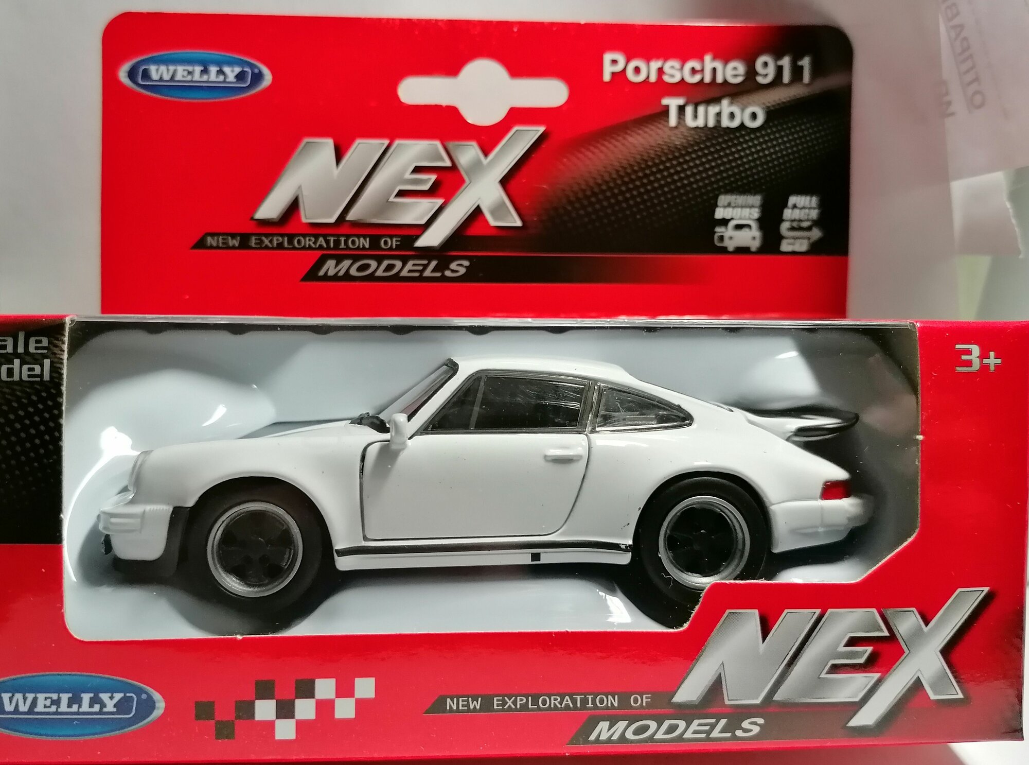 Игрушка Welly Машинка 1:38 Porsche 911 Turbo (930), пруж. мех, белый