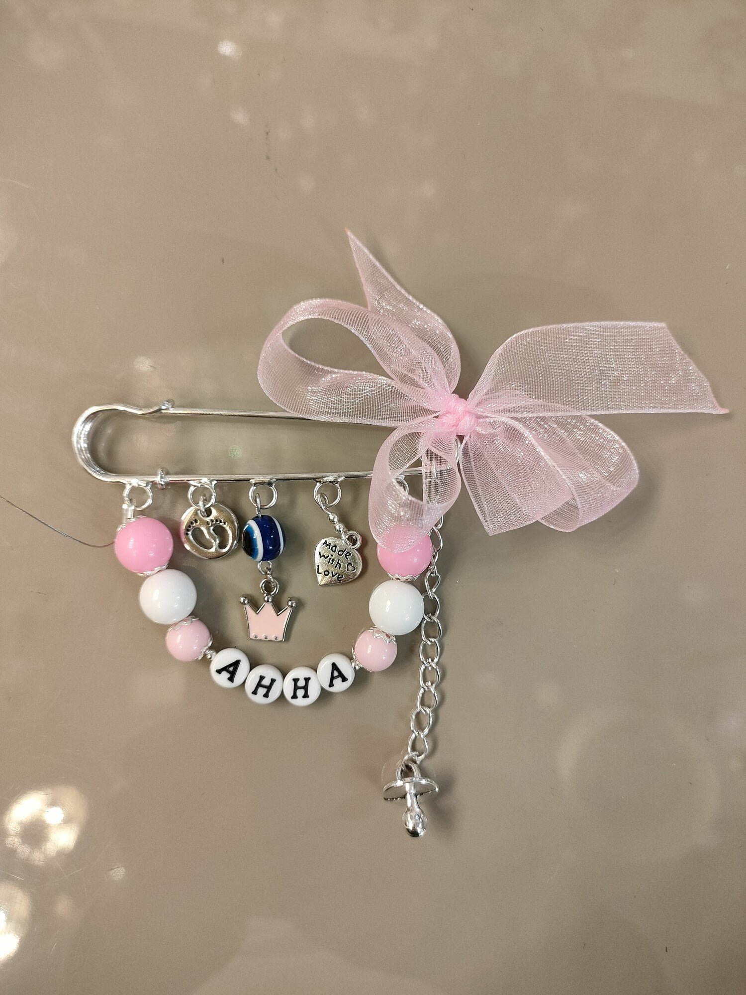 Булавка-оберег от сглаза для новорожденных на коляску