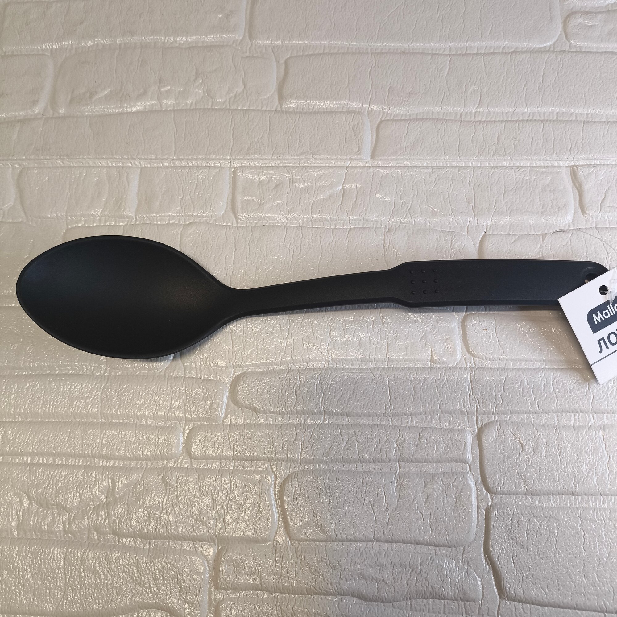 Ложка кулинарная из термостойкого нейлона длина 30 см, ширина 6 см, цвет - черный .