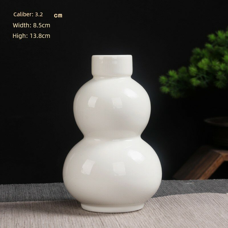 Белая керамическая ваза-тыква для гидропоники и сухоцветов, создающая традиционную китайскую цветочную композицию для