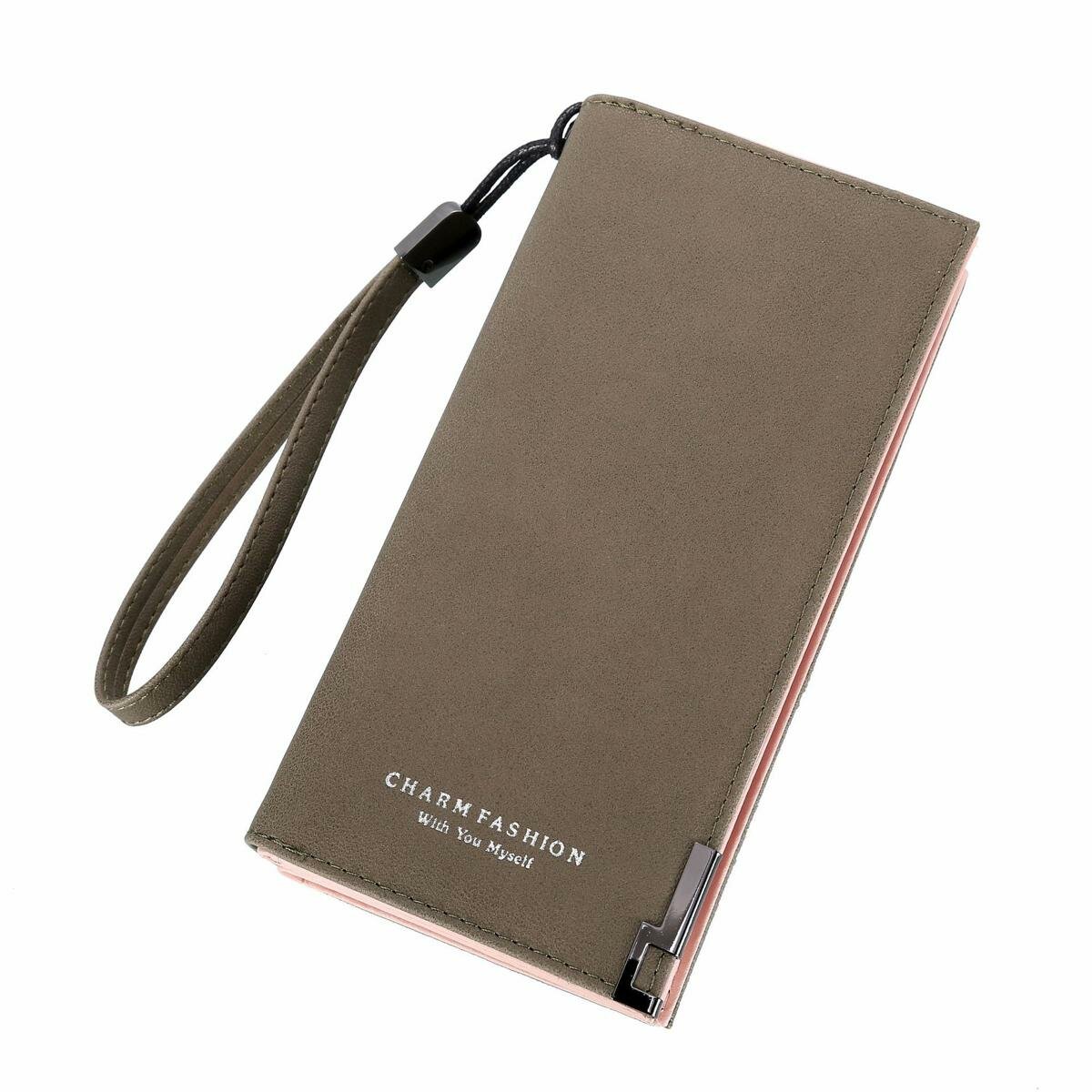 Эксклюзивный женский кошелек премиумкласса с удлиненным форматом и матовой фактурой, дополнен запястным ремешком, а также оснащен специальным отделением для банкнот и застежкоймолнией