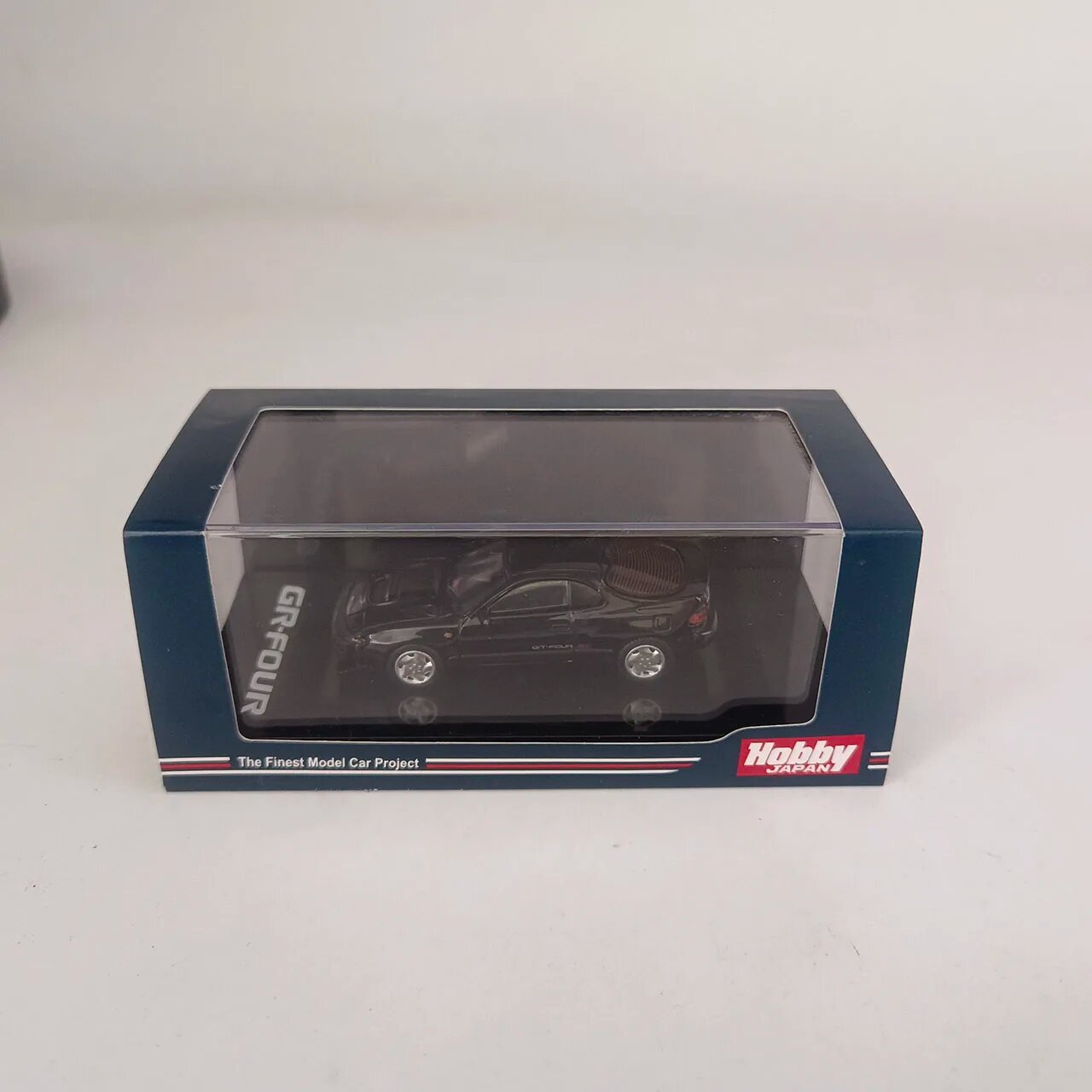 Модель автомобиля Toyota Celica GT-FOUR 1:64, цвет Spinning wheel F