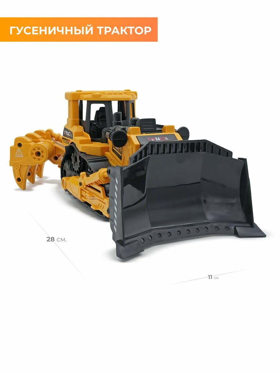 Большой жёлтый грейдер трактор с отвалом. Инерционный механизм