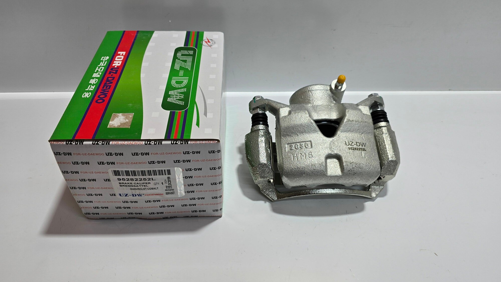Суппорт передний левый в сборе со скобой (с ABC) Кобальт, Равон Р4