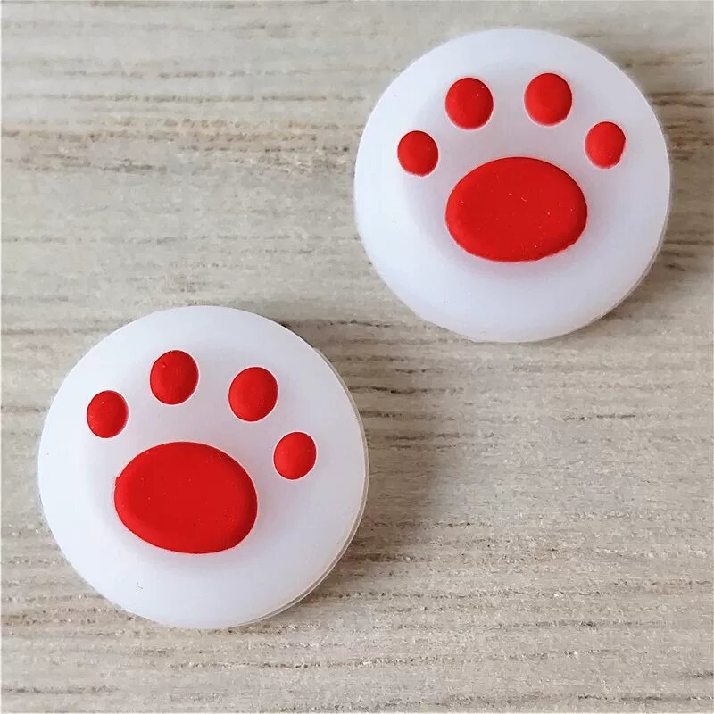 Прозрачные и красные накладки с котячьими лапками из силикона на джойстик для Nintendo Switch, пара (2 шт)