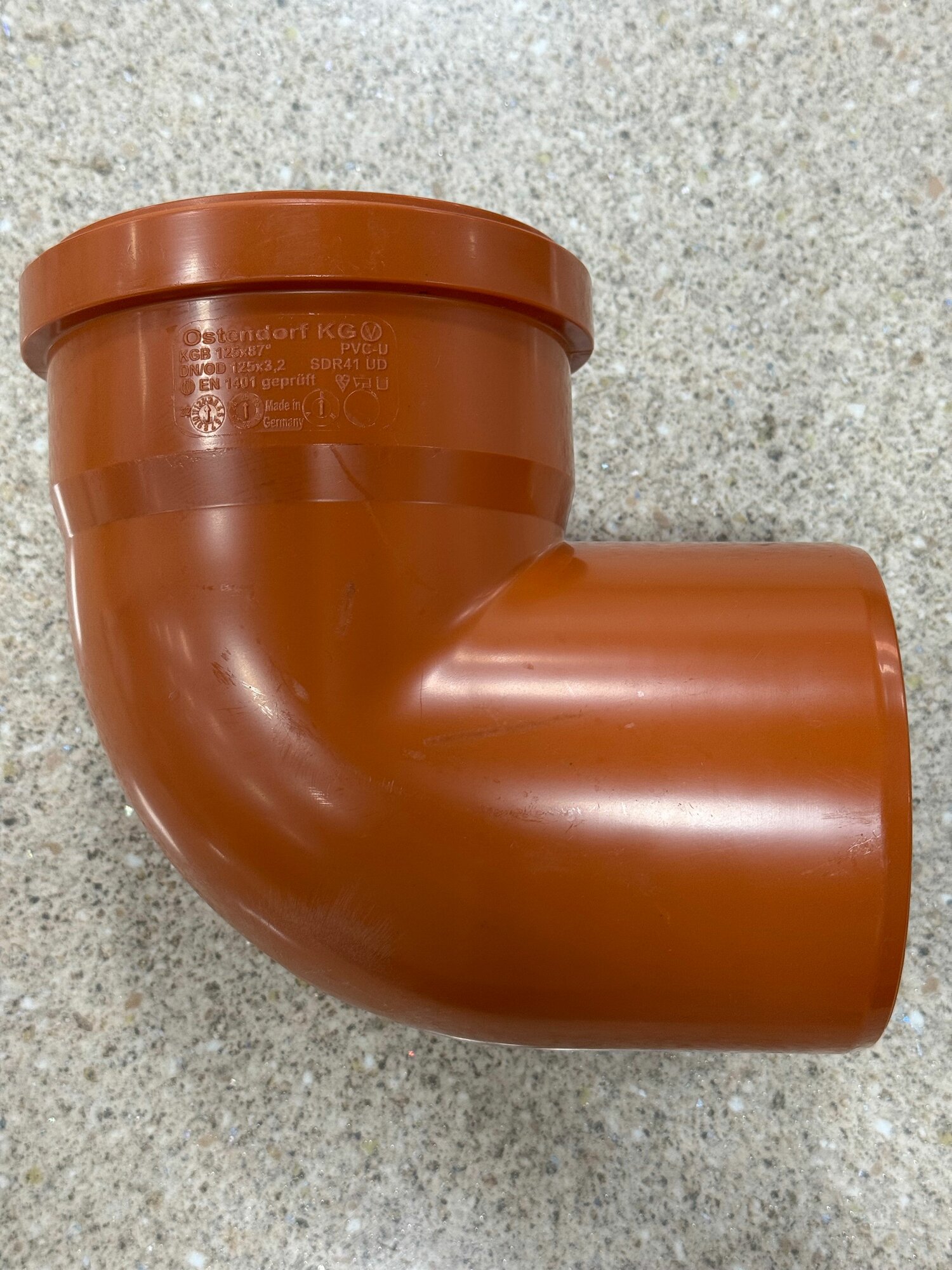 Отвод наружный 125х87гр. Ostendorf рыжий