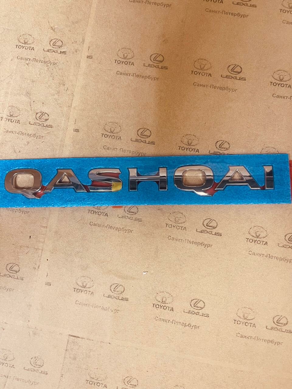 90892JD000 Значок крышки багажника Nissan Qashqai