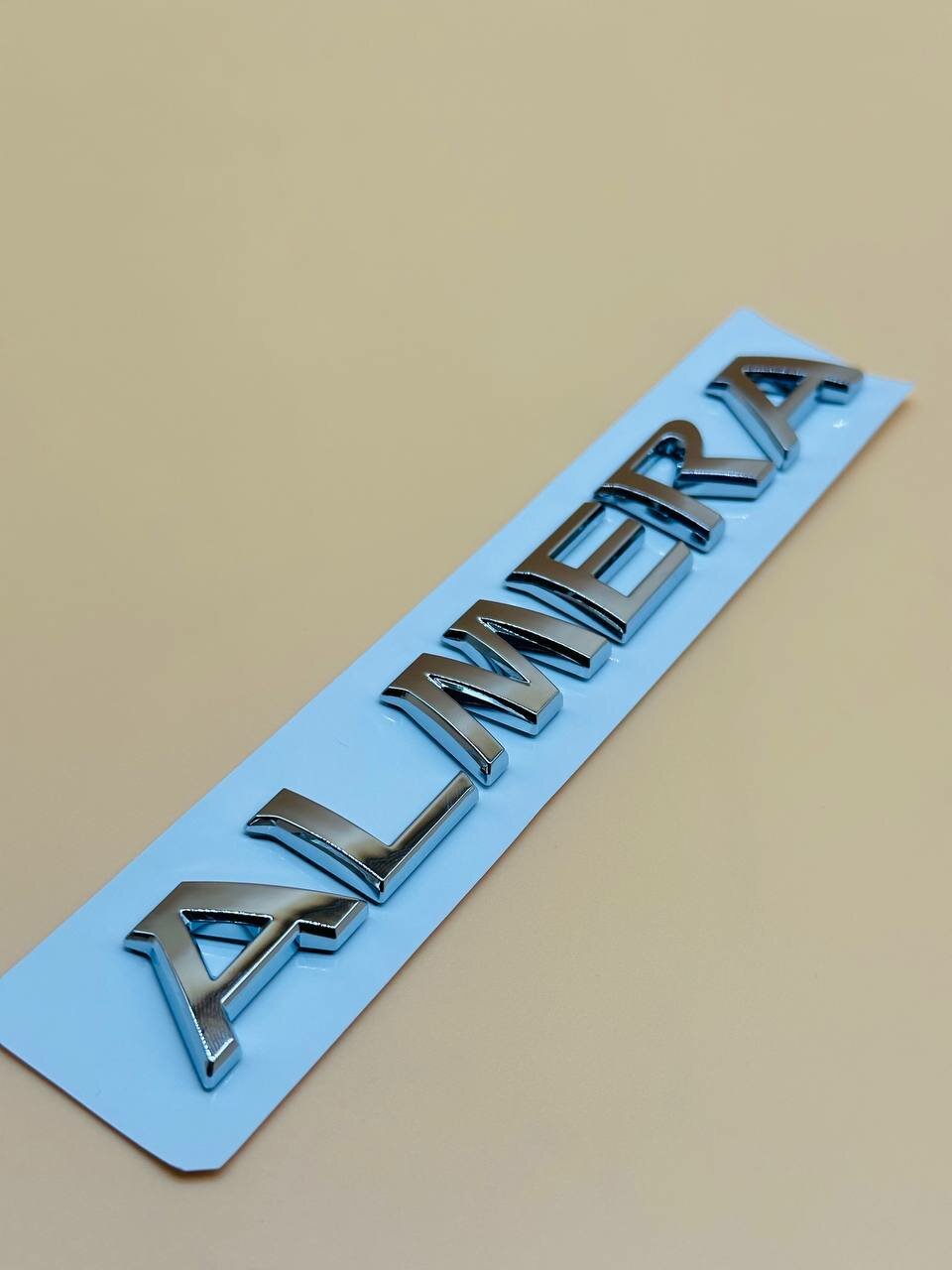 Шильдик Наклейка на багажник Nissan Almera Хром 19см