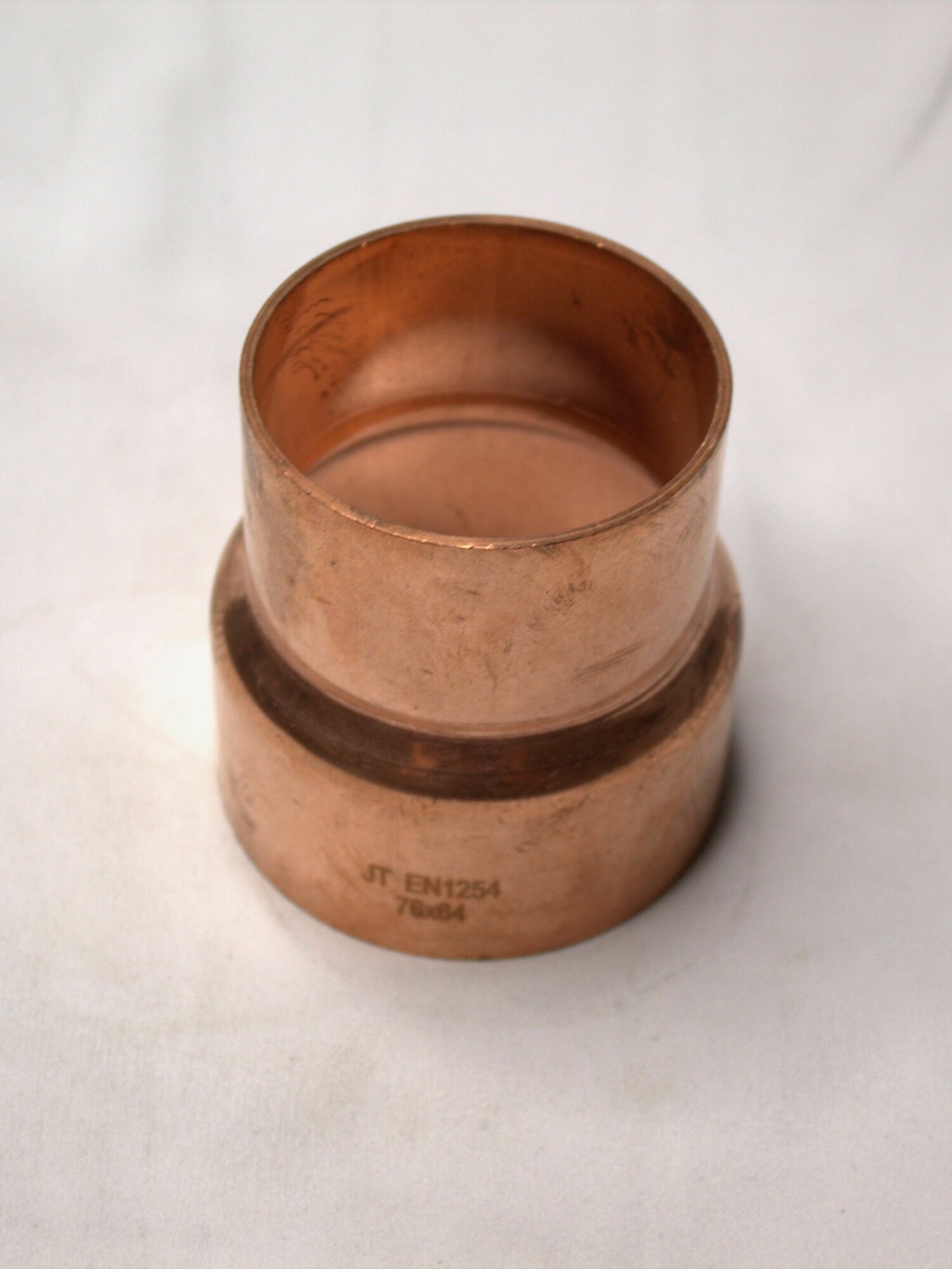 Муфта медная двухраструбная переходная 76х64