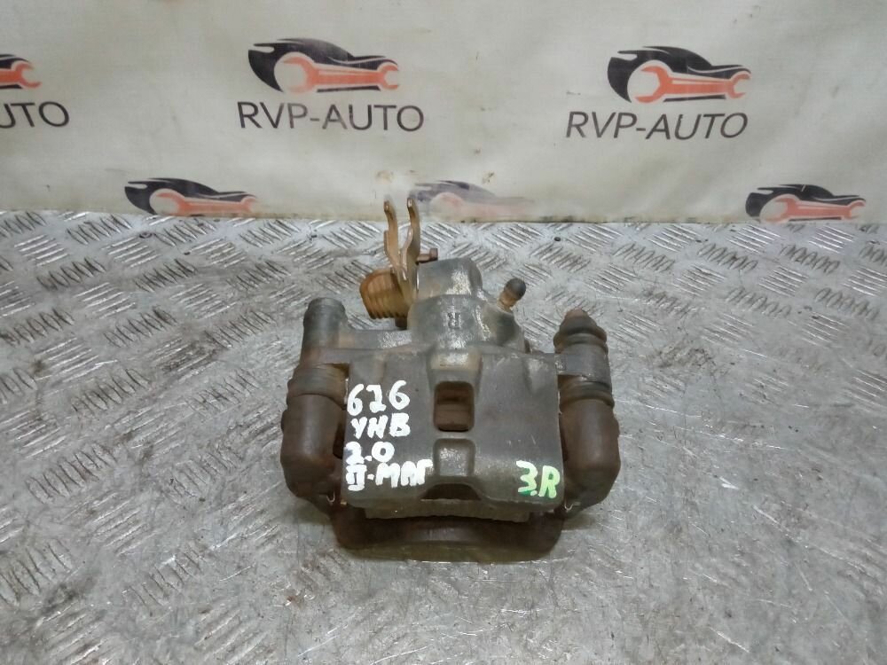 Суппорт задний правый Mazda 626 GW 2.0 1997-2002