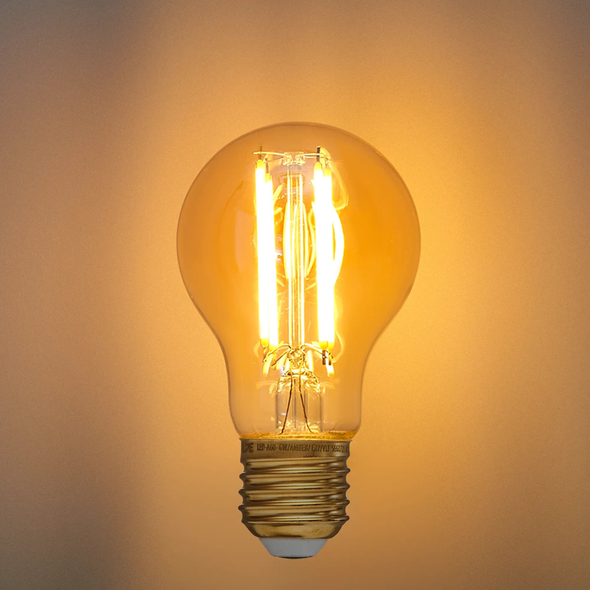 Лампа светодиодная филаментная Volpe E27 220 В 6 Вт груша прозрачная с золотистым напылением 500 лм, теплый белый свет