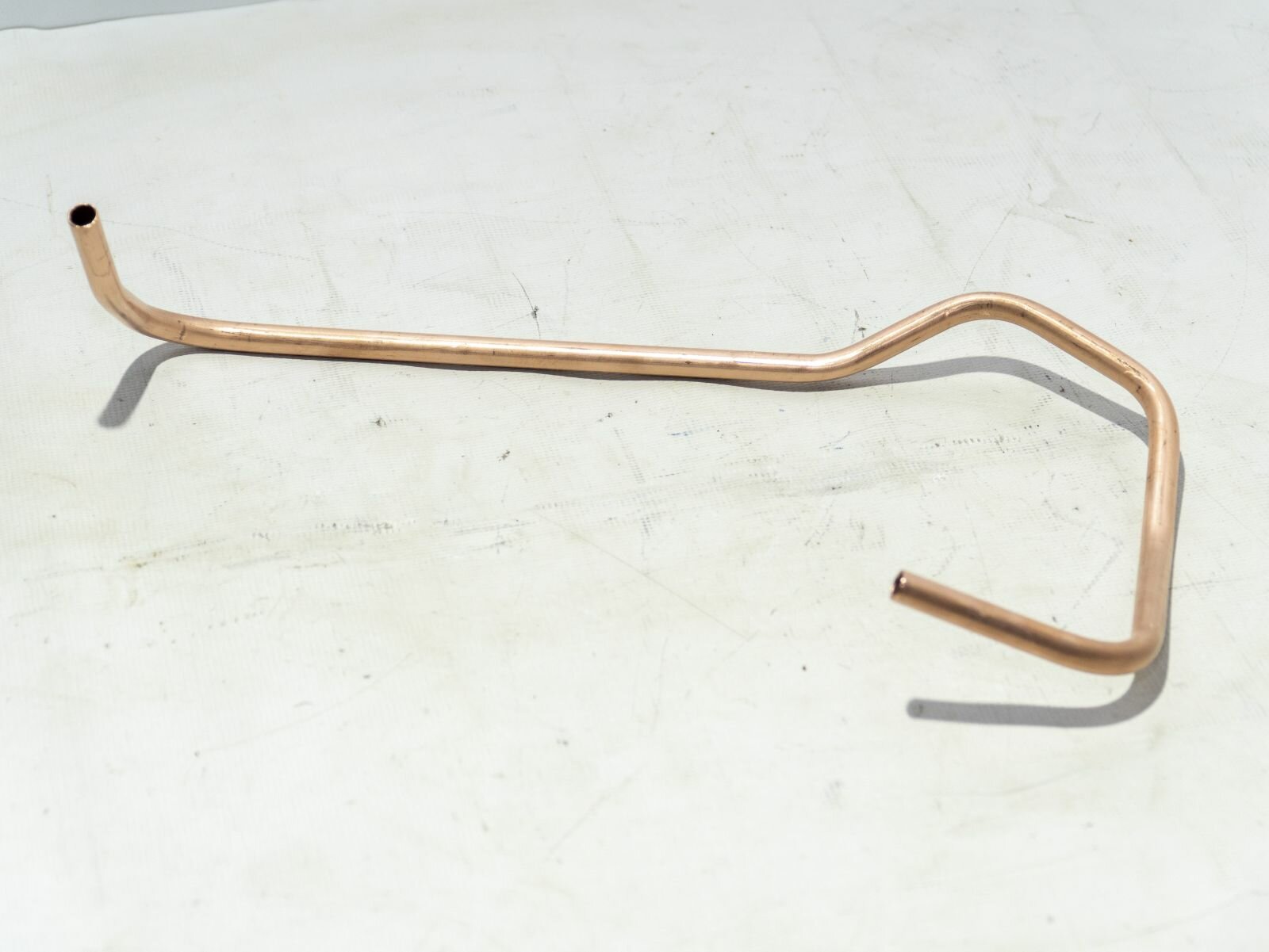 Трубка отвода охлаждающей жидкости от компрессора