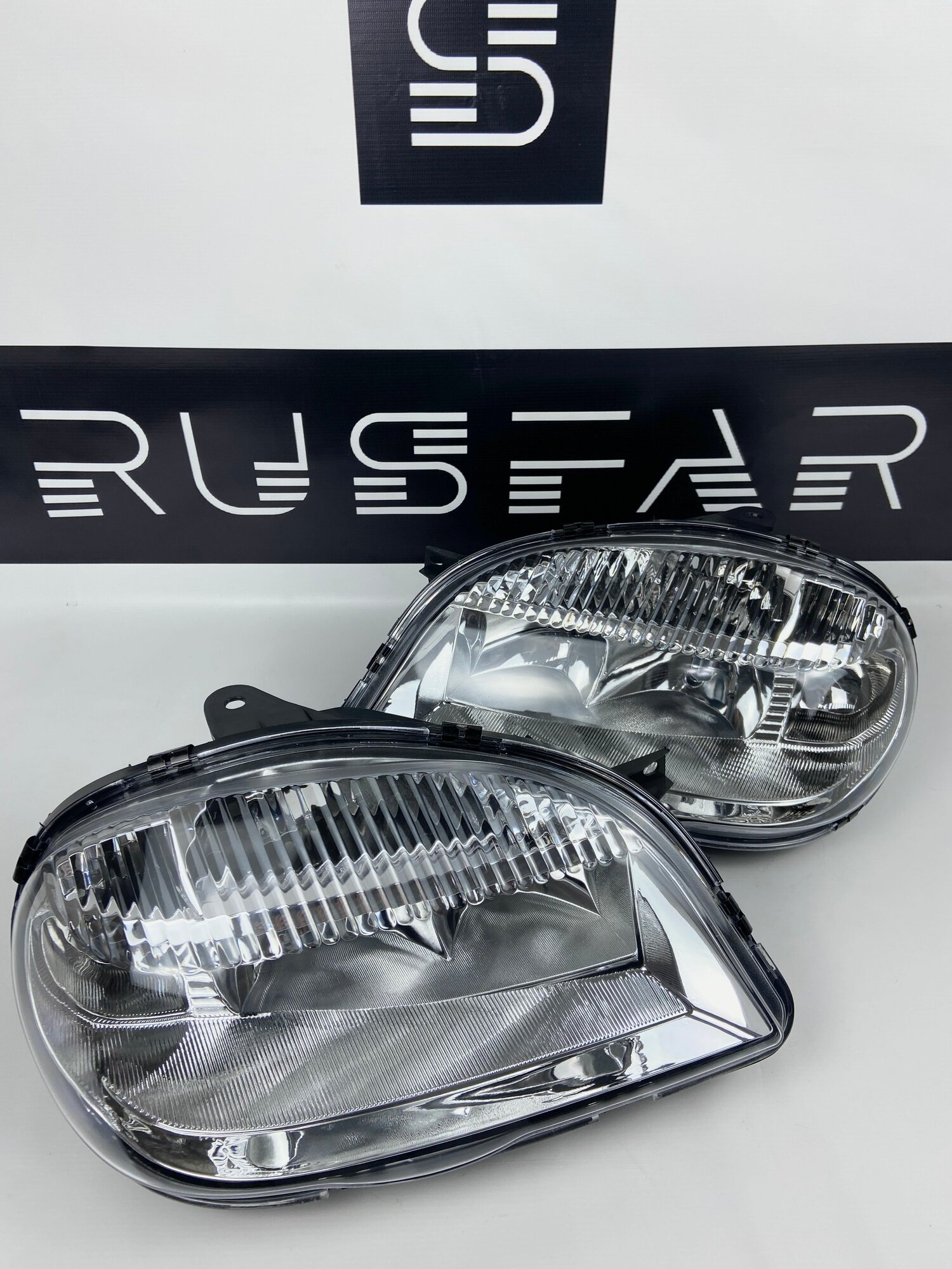 Фара русфар для Chevrolet Niva Шевроле Нива с пластиковым рассеивателем 55Вт цоколь H1/H7