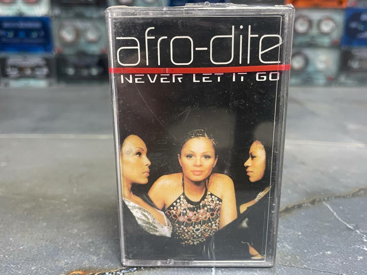 Afro-dite: never let it go, кассета, аудиокассета (МС), 2004