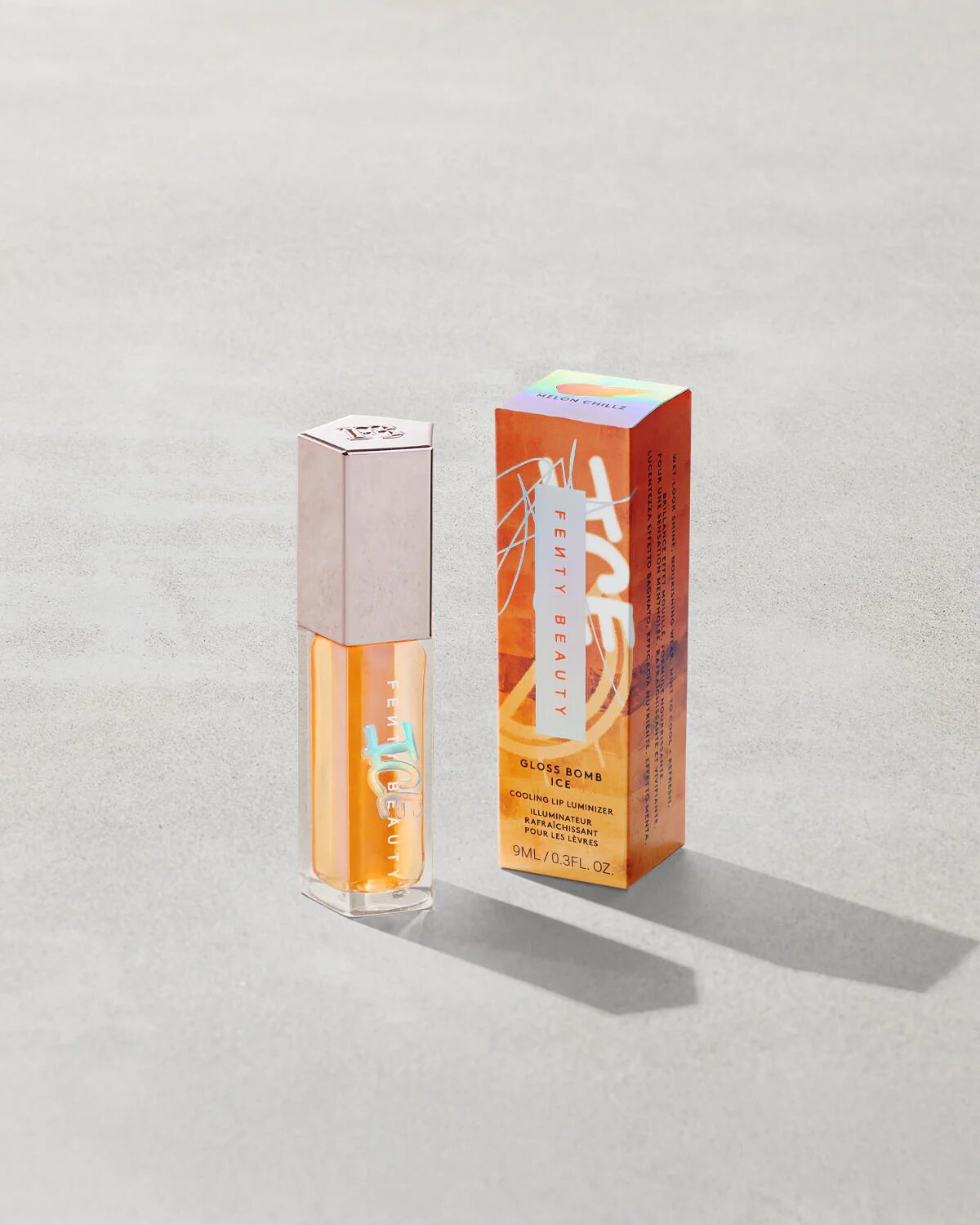 Fenty Beauty Блеск с освежающим эффектом Gloss Bomb Ice Cooling Lip Luminizer, Melon Chillz