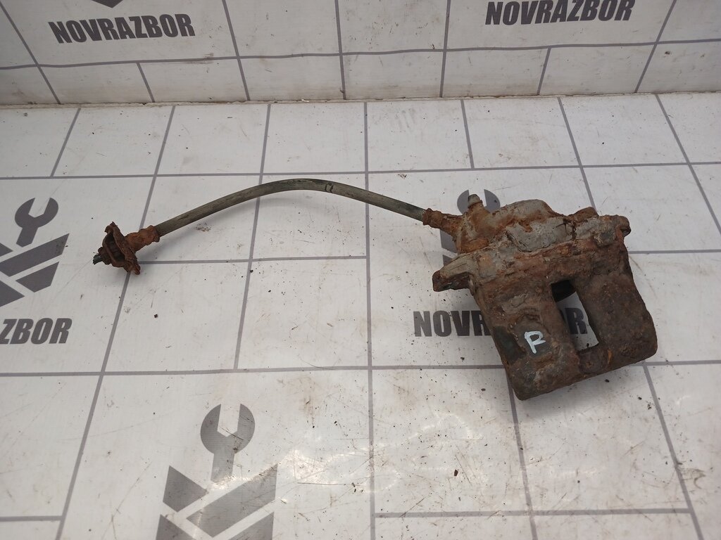 Суппорт передний правый Renault Logan 2005-2014