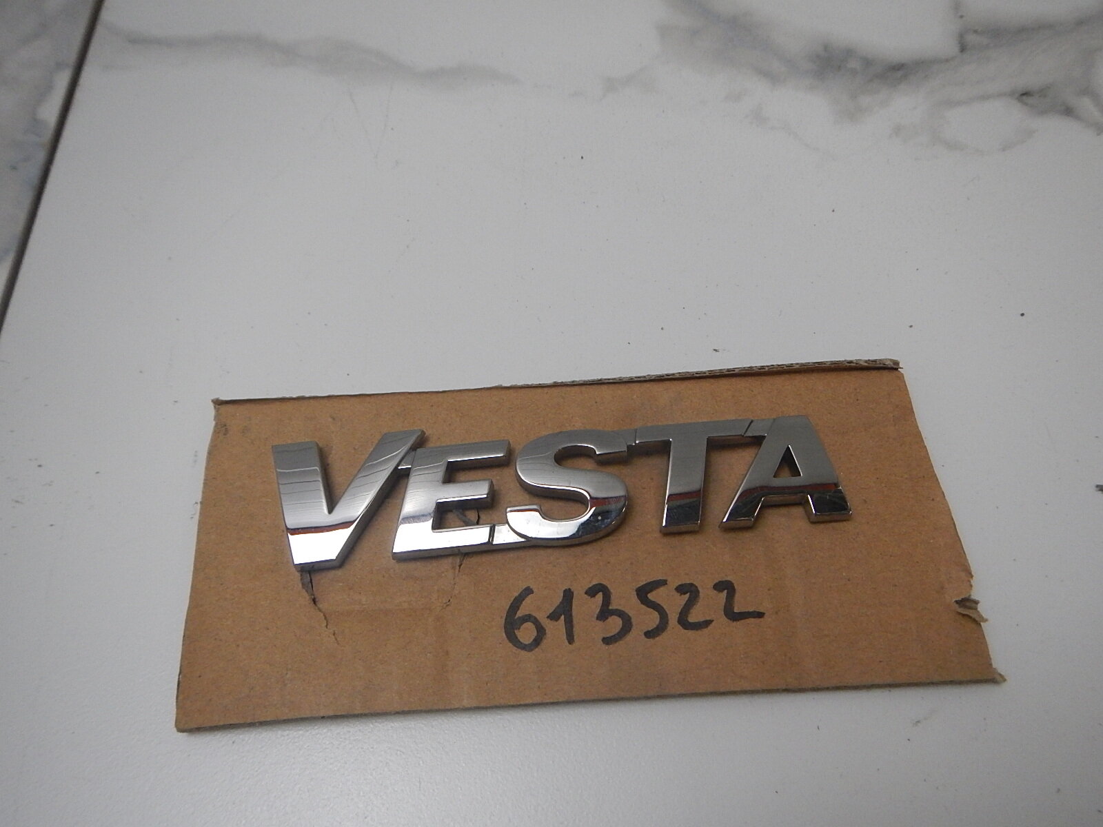 Б/У Эмблема на крышку багажника, ВАЗ (VAZ)-LADA VESTA (веста) LADA VESTA (Веста) 22- Потертости. 613522 LADA арт. 8450007832