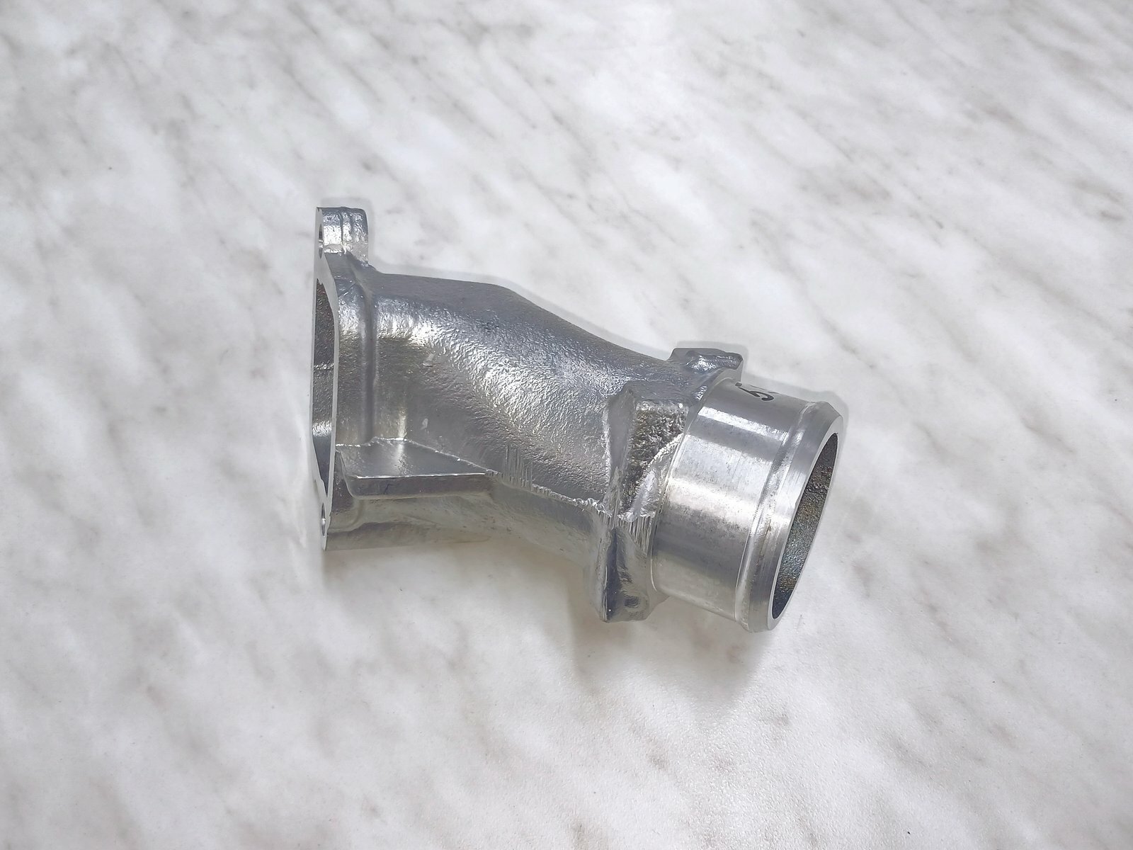 Патрубок подводящий насоса водяного ЯМЗ-534, 536