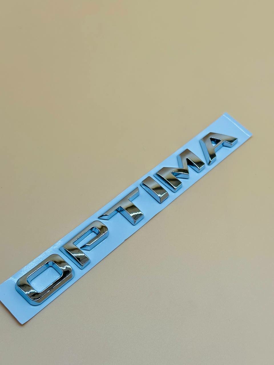 Шильдик Наклейка на багажник Optima Хром 17 см