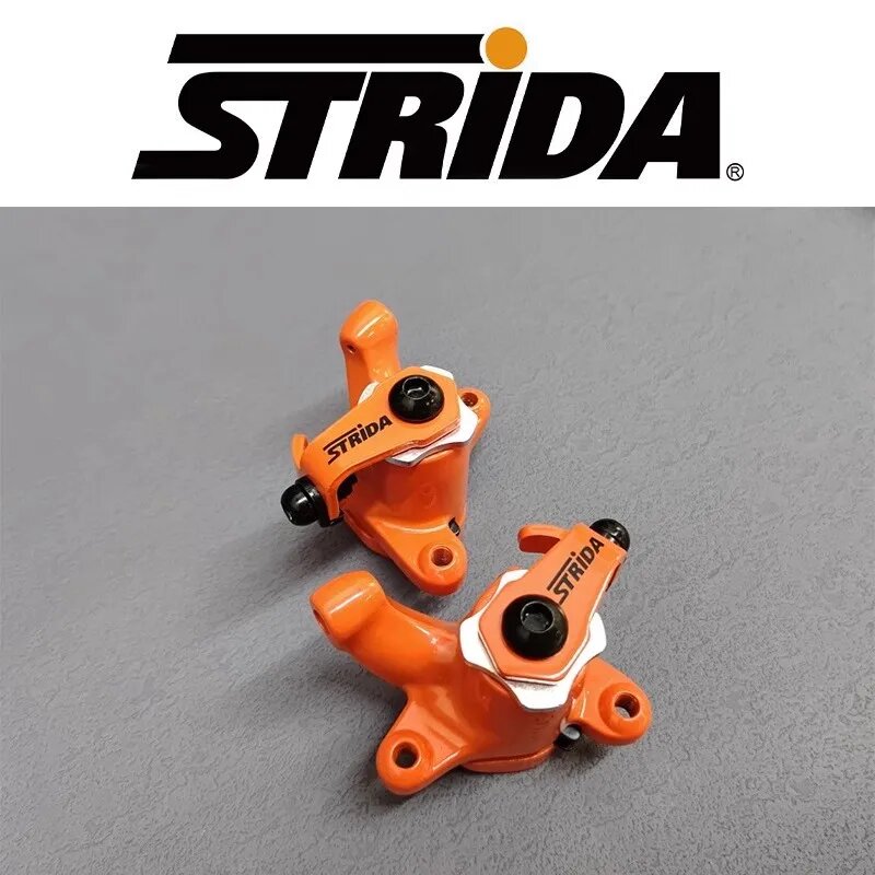Зажим дискового тормоза Strida оранжевый