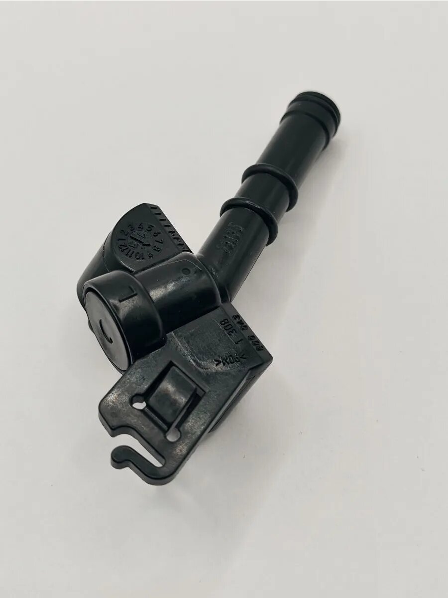 Форсунка омывателя фары левая