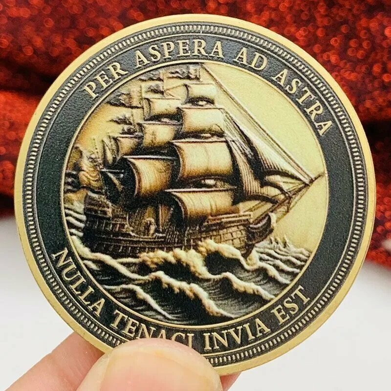 Парусный якорь, пересекающий зеленую бронзовую памятную монету