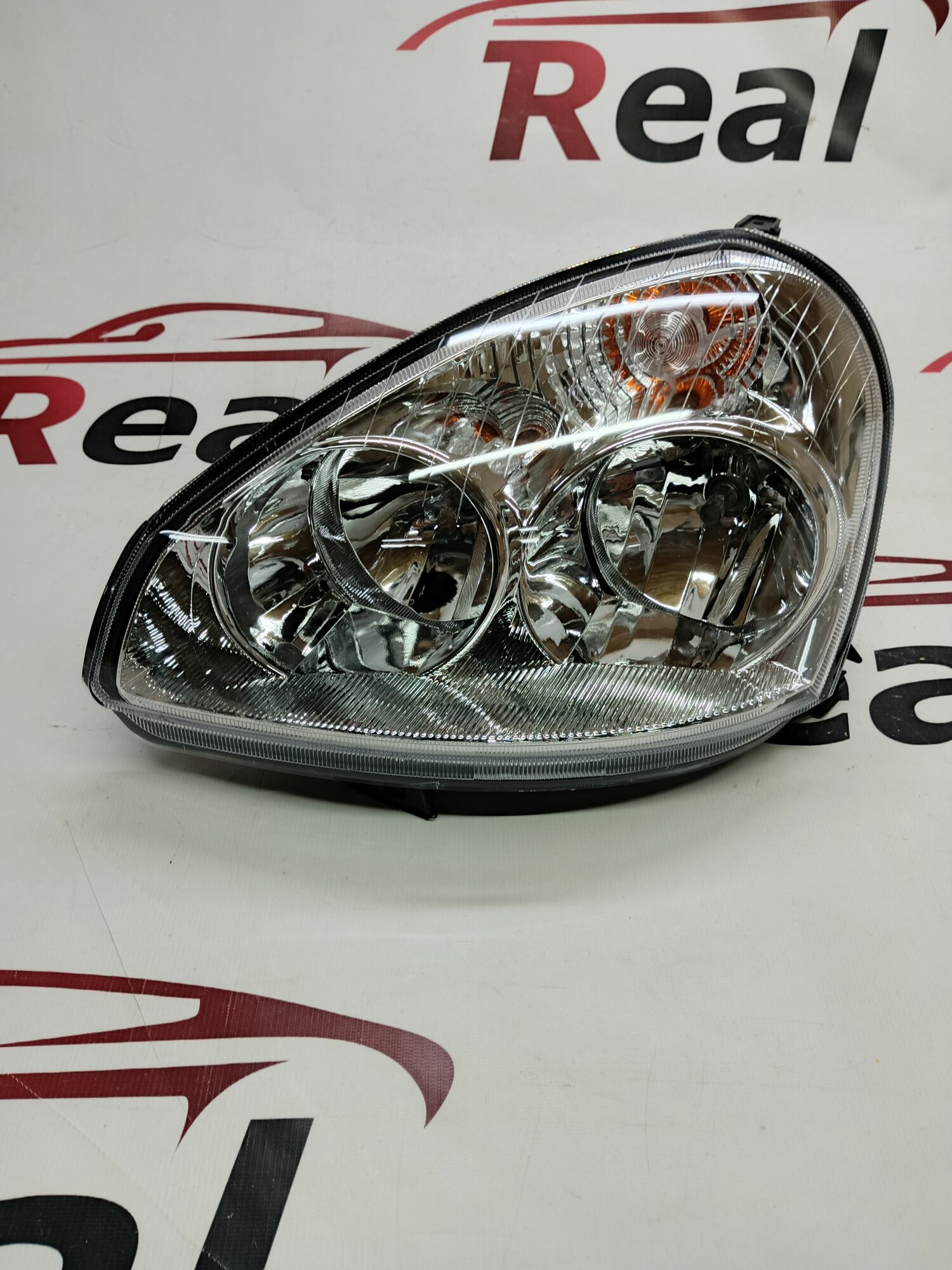 Блок фара левая 21704 (рестайлинг с ДХО) (ан. Bosch", б/л, пластик)