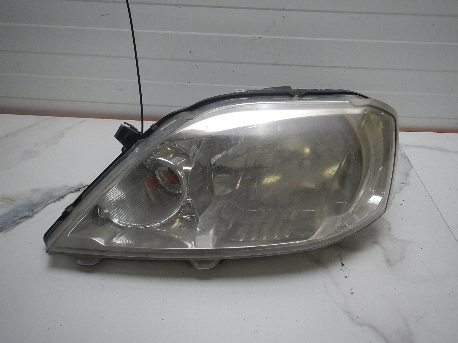 Б/У Фара левая, Renault (Рено)-LOGAN (05-) RENAULT LOGAN (05-) 12- Сломано 2 крепления, Трещина на корпусе, отколот кусок...