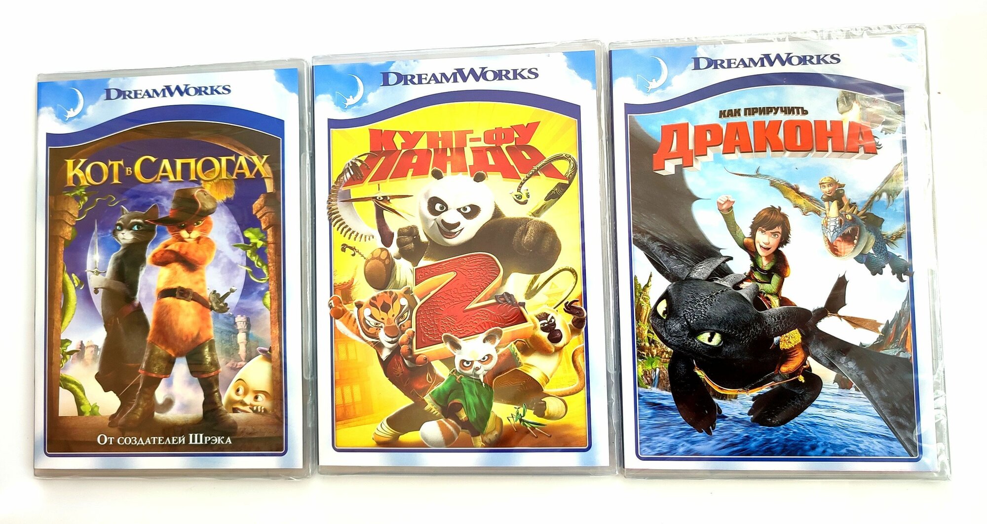 Мультфильмы. DreamWorks. Как приручить дракона. Кот в сапогах. Кунг-фу Панда 2 (3 DVD диска) приключения для всей семьи / 6+, 3 отдельных бокса
