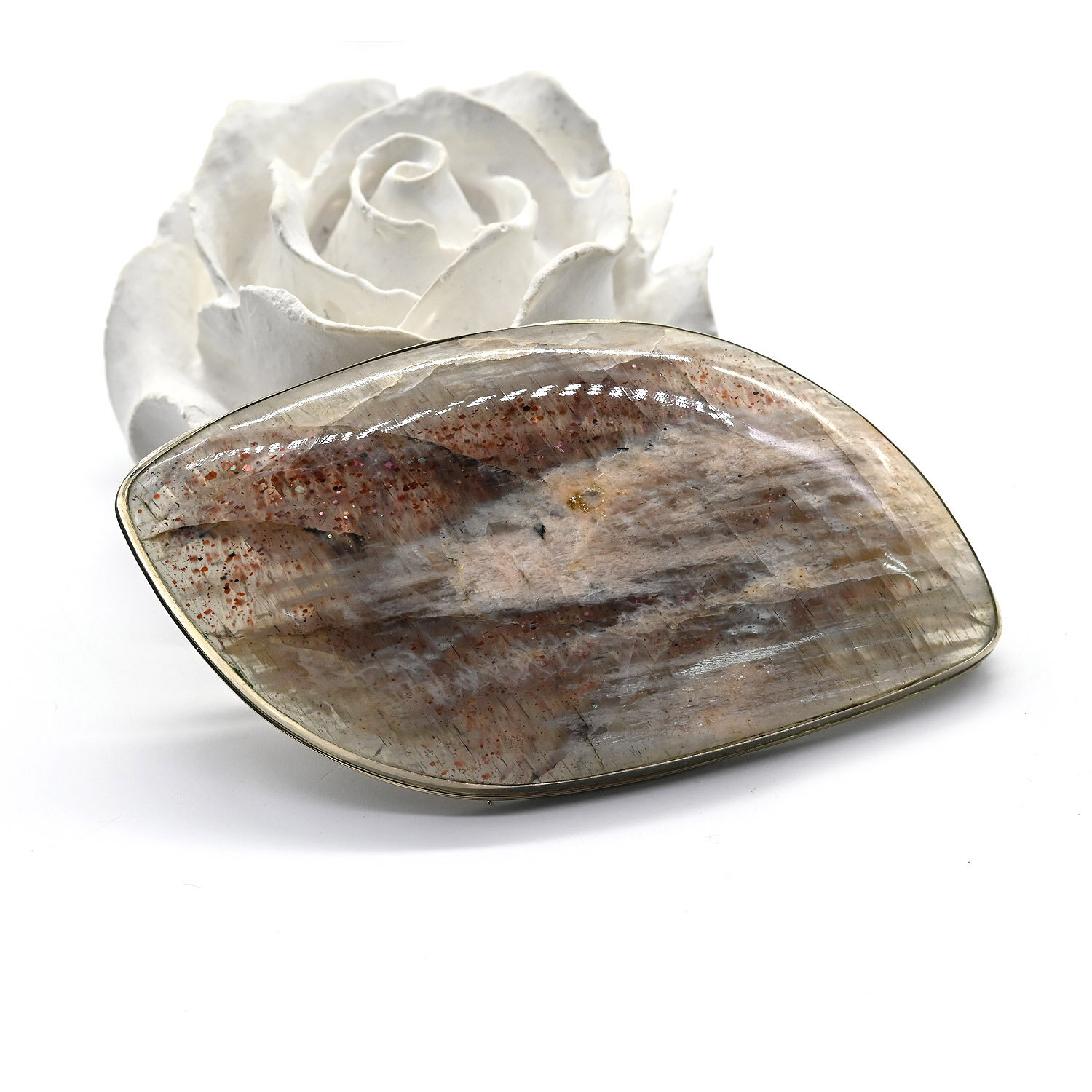 Брошь, гeлиoлит