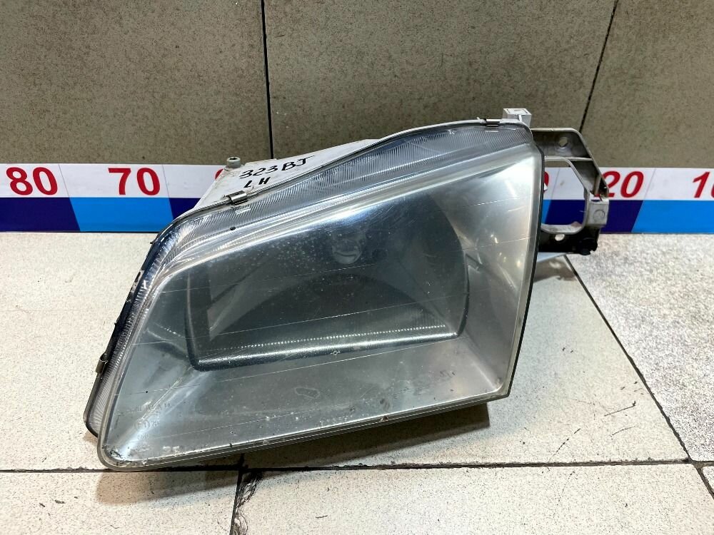 Фара левая Mazda 323 BJ 1305235392