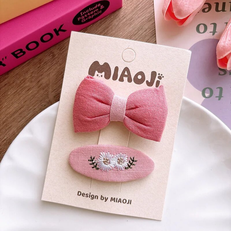 Корейские тканевые заколки с бантом розового цвета Y202506 8-Bow Embroidery Set