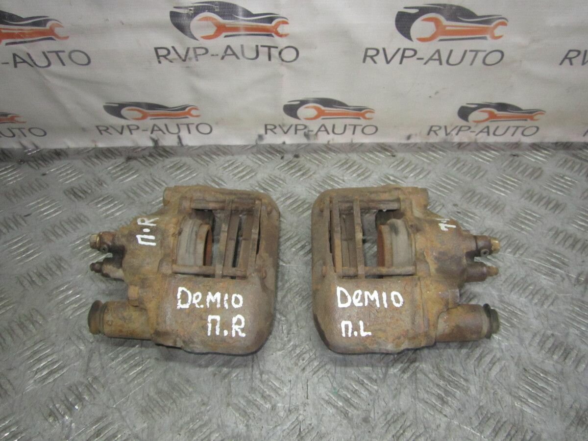 Суппорт тормозной передний Mazda Demio DW 1996-99