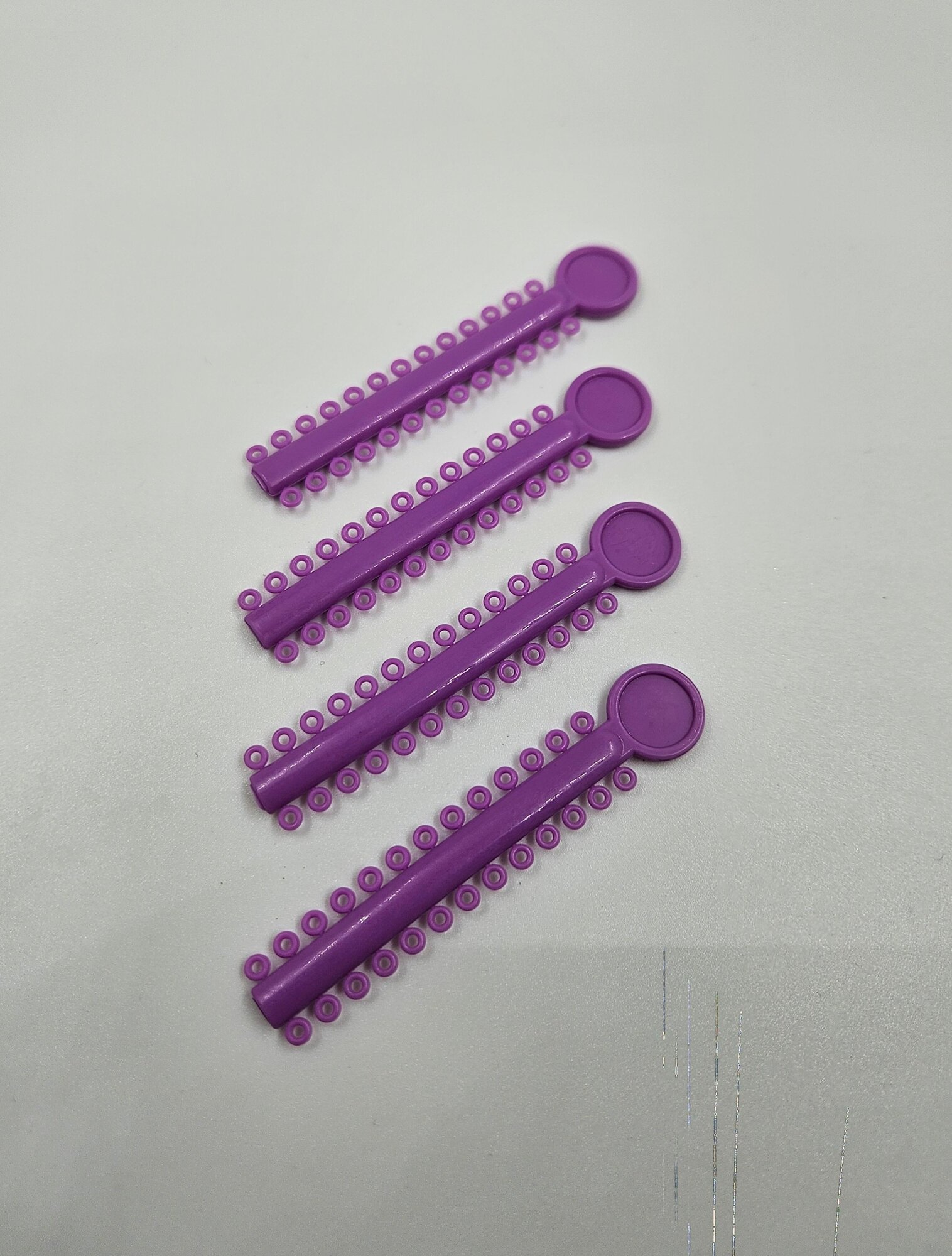 Ортодонтические эластичные лигатуры для брекетов на модуле Kronen Ties 4 шт цвет сиреневый